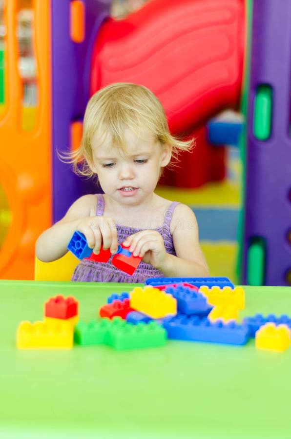 Child Playing with Bright Plastic Construction Blocks Stock Photo ...