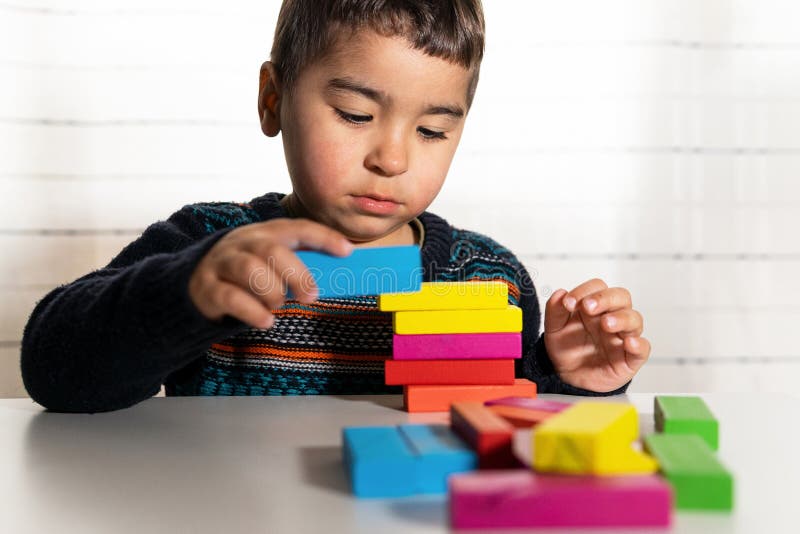 Child Playing Building Blocks. Playing and Learning at Home. Building ...