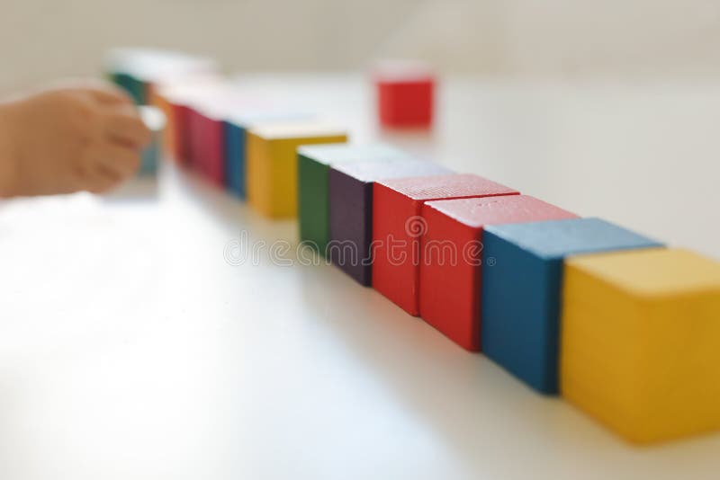 Child Playing and Building with Colorful Wooden Toy Bricks on White ...