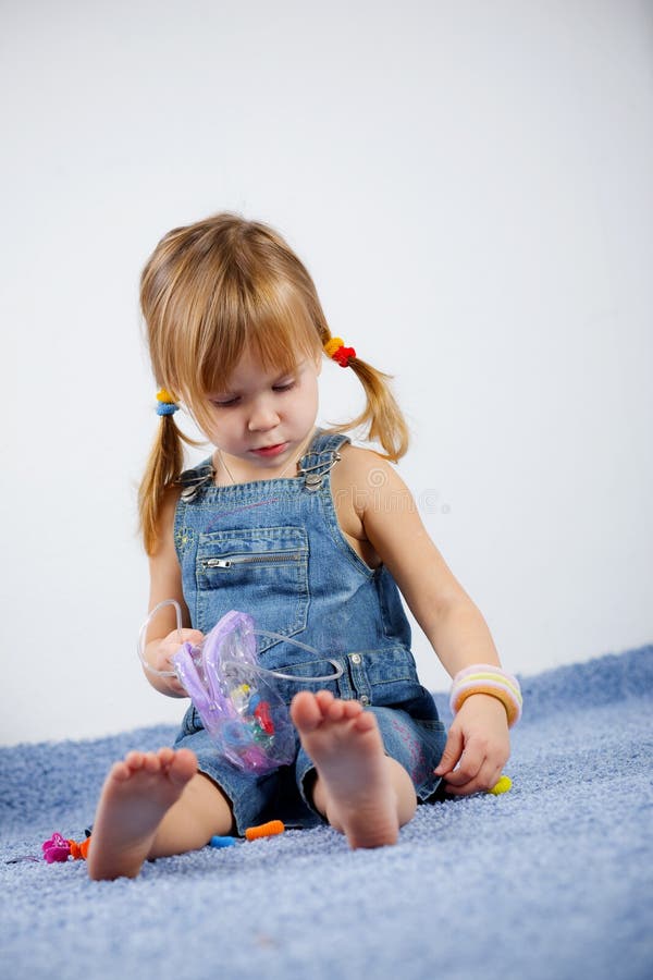 Child playing on carpet stock image. Image of nursery - 10436147