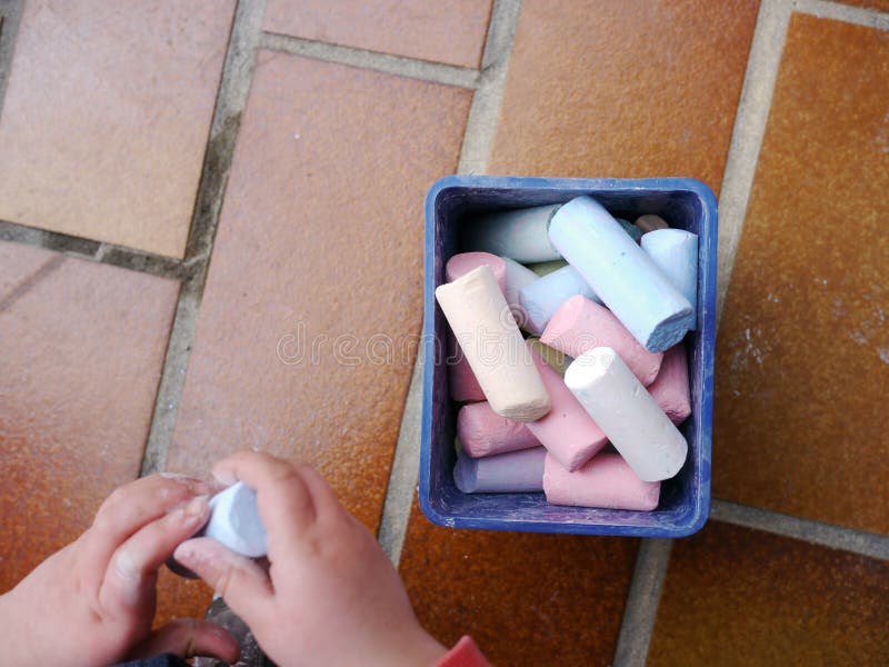 Child playing with chalk stock image. Image of education - 66347819