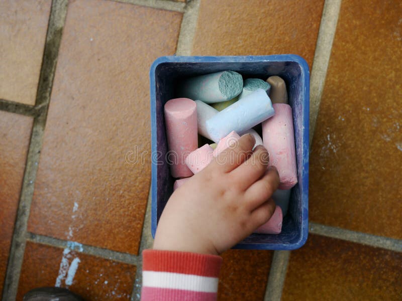 Child playing with chalk stock image. Image of cute - 108405407