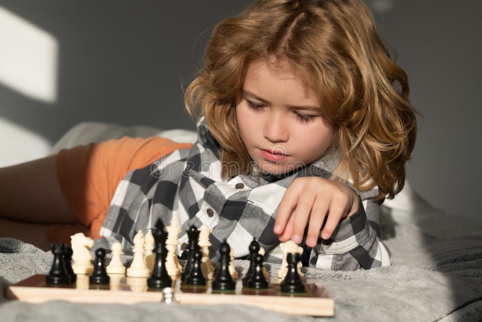 Child Playing Chess at Home. Clever Concentrated and Thinking Child ...