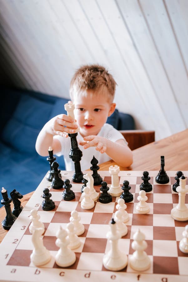 Child Playing Chess at Home at the Table Stock Image - Image of leisure ...