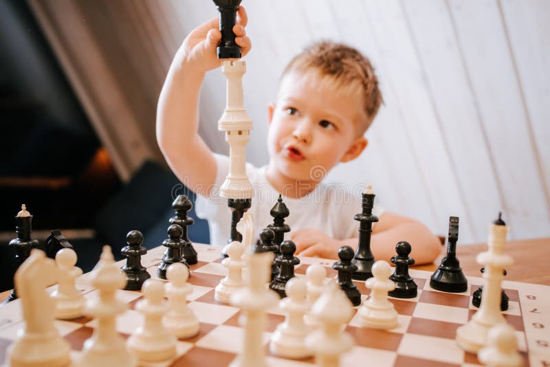 Child Playing Chess at Home at the Table Stock Image - Image of game ...