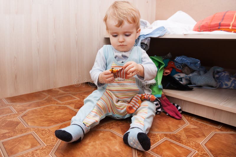Child playing with clothes stock image. Image of household - 73433197