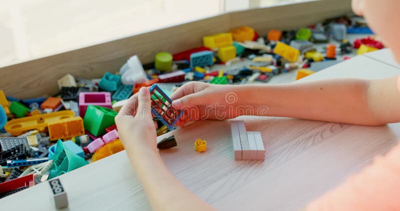 Child Playing with Colorful Building Blocks on Table Stock Video ...