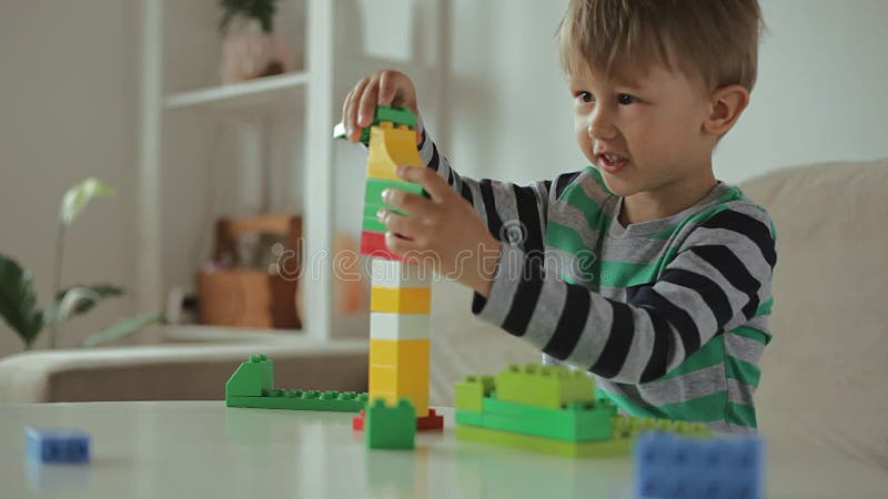 Child Playing with Colorful Building Plastic Blocks Constructor at Home ...