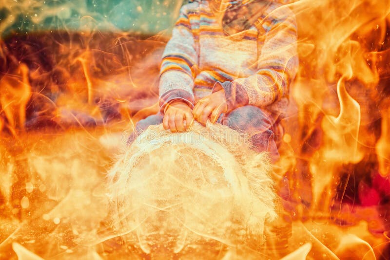 Child Playing a Djembe Drum with Natural Goat Fur Features. Fire Effect ...