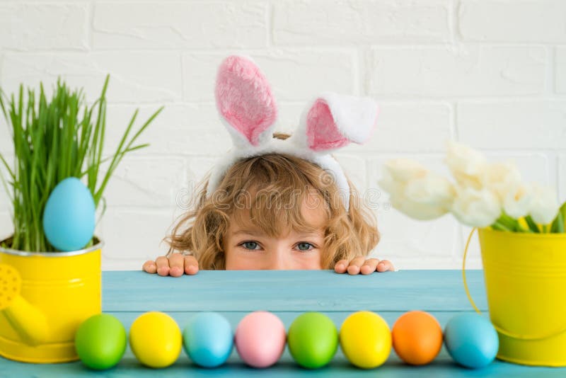 Child Playing with Easter Bunny Stock Photo - Image of background ...