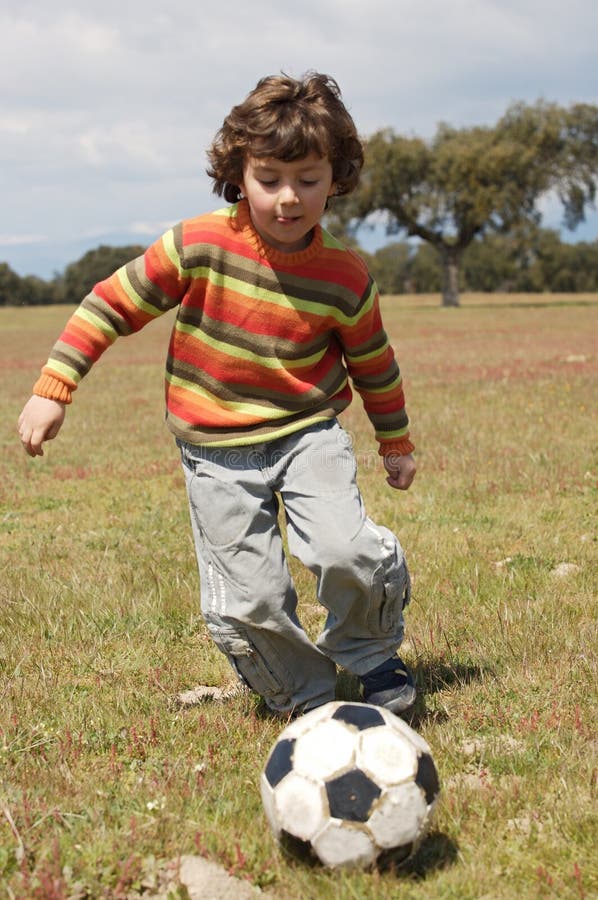 Child playing football stock image. Image of happiness - 4147537