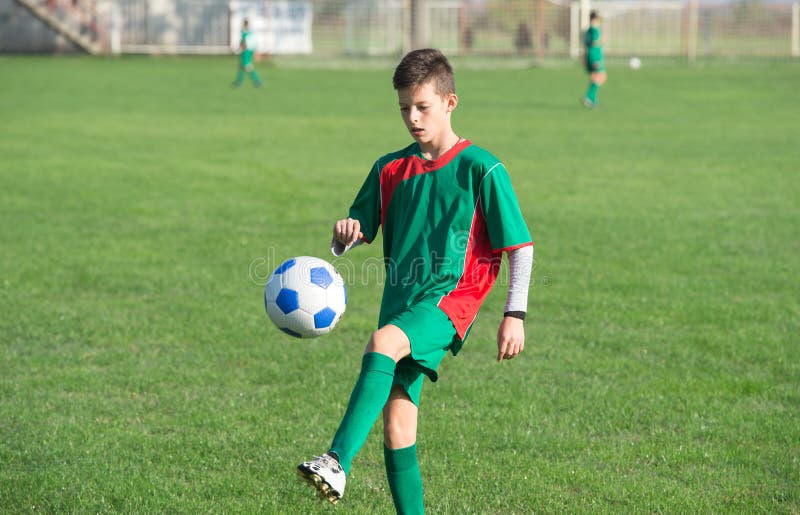 Child playing football stock photo. Image of equipment - 47716596