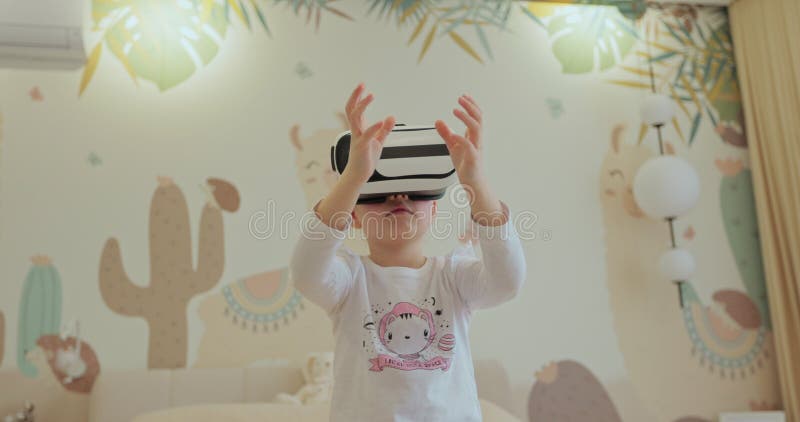 Child Playing Games on Virtual Reality Device. Girl Learning Using ...