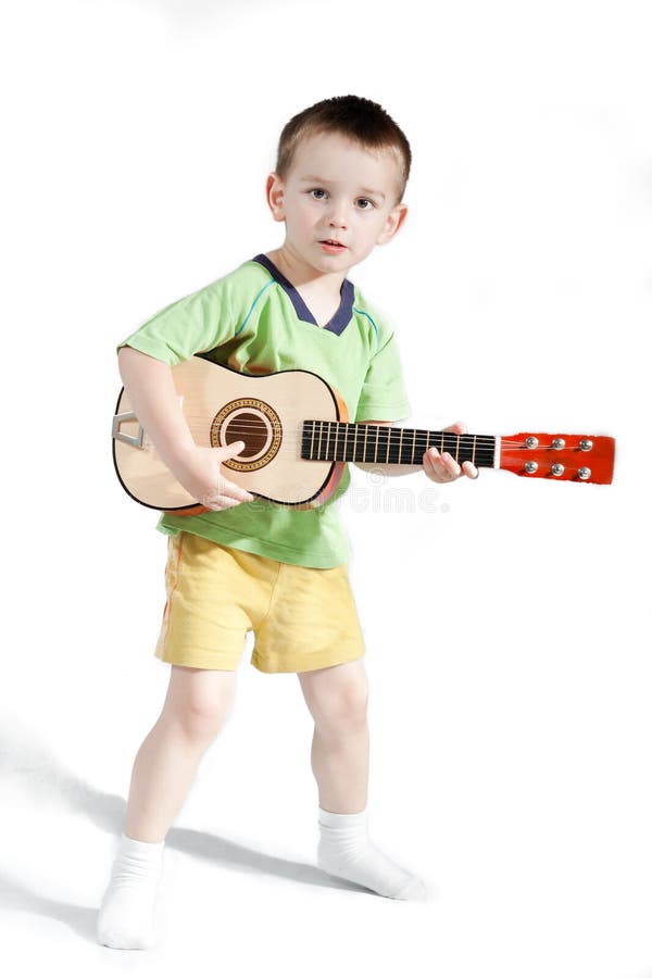 Child playing on guitar stock photo. Image of melody - 43507878