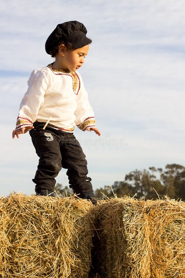 Child Playing in a Haystack. Stock Photo - Image of life, childhood ...