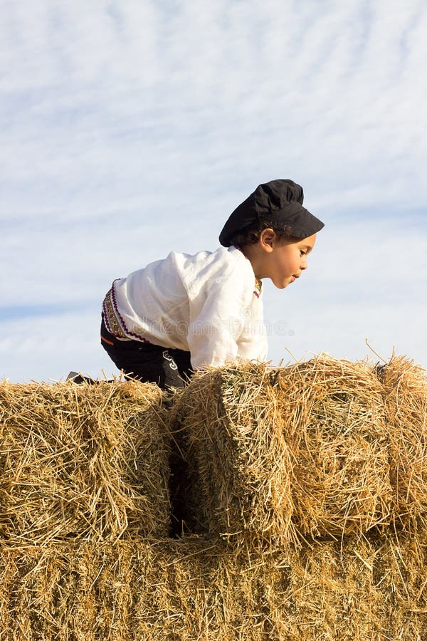 Child Playing in a Haystack. Stock Photo - Image of grass, beautiful ...