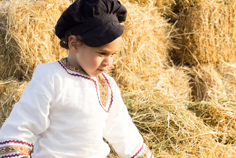 Child Playing in a Haystack. Stock Image - Image of grass, cute: 50946079
