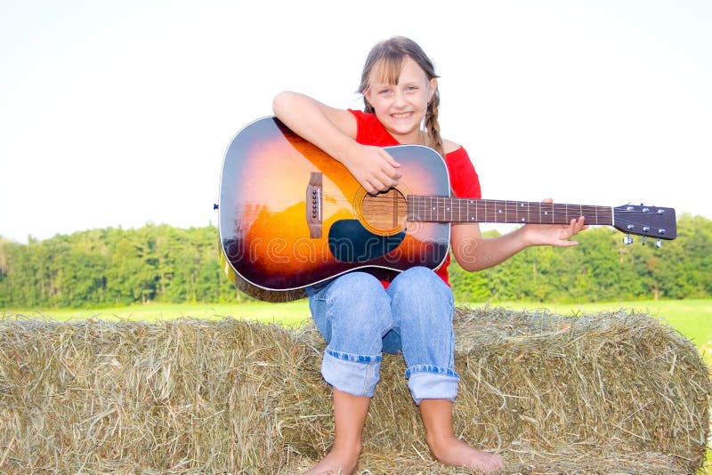 Child playing instrument. stock photo. Image of bales - 10532680