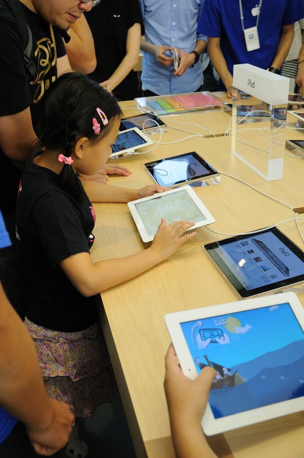 Child playing Ipad2 editorial stock image. Image of brand - 21329969