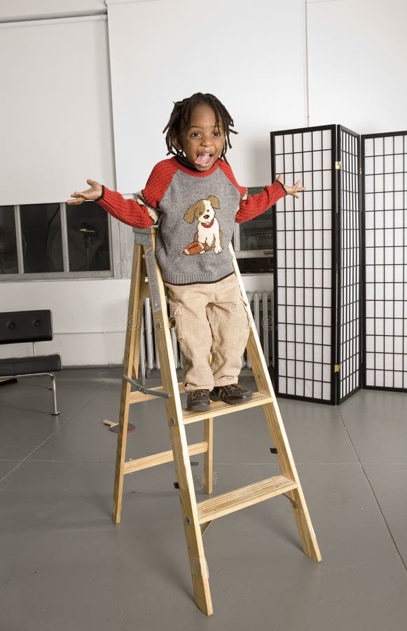 Child playing on a ladder stock photo. Image of humor, ethnic - 475124