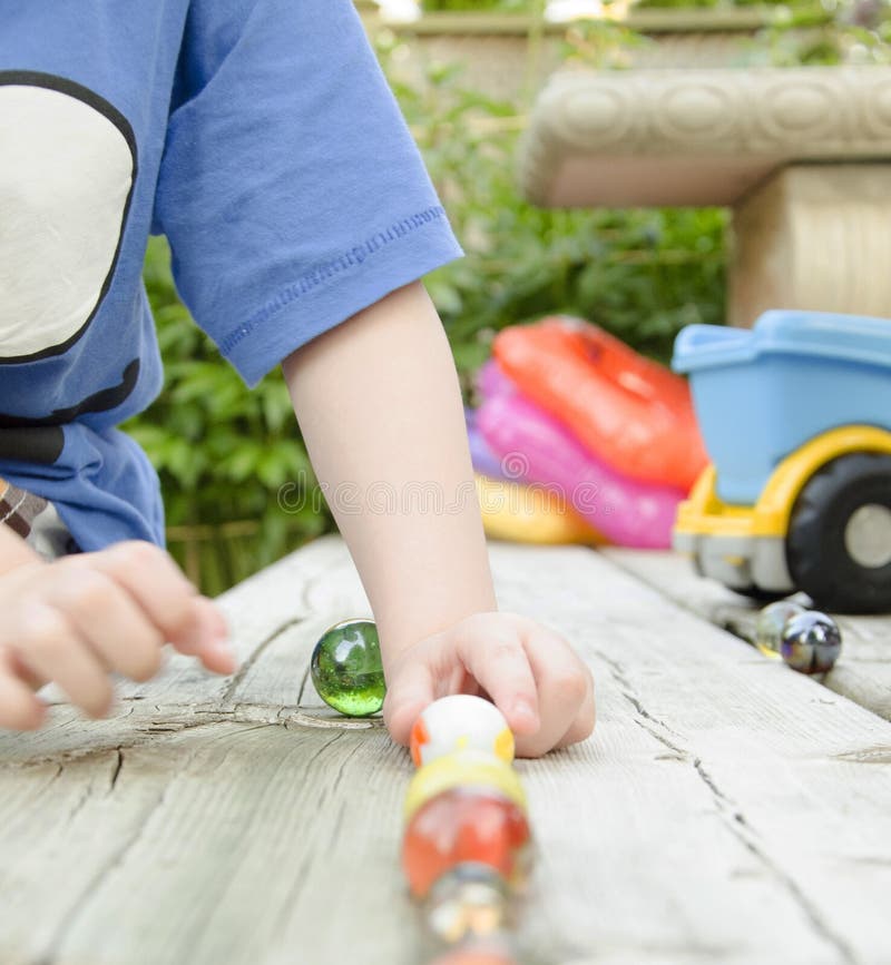 Play marbles 2 stock image. Image of plays, school, hand - 2536527