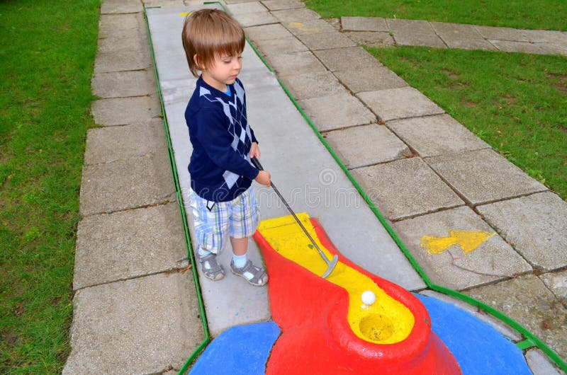 Child playing mini golf stock image. Image of golf, child - 26027261