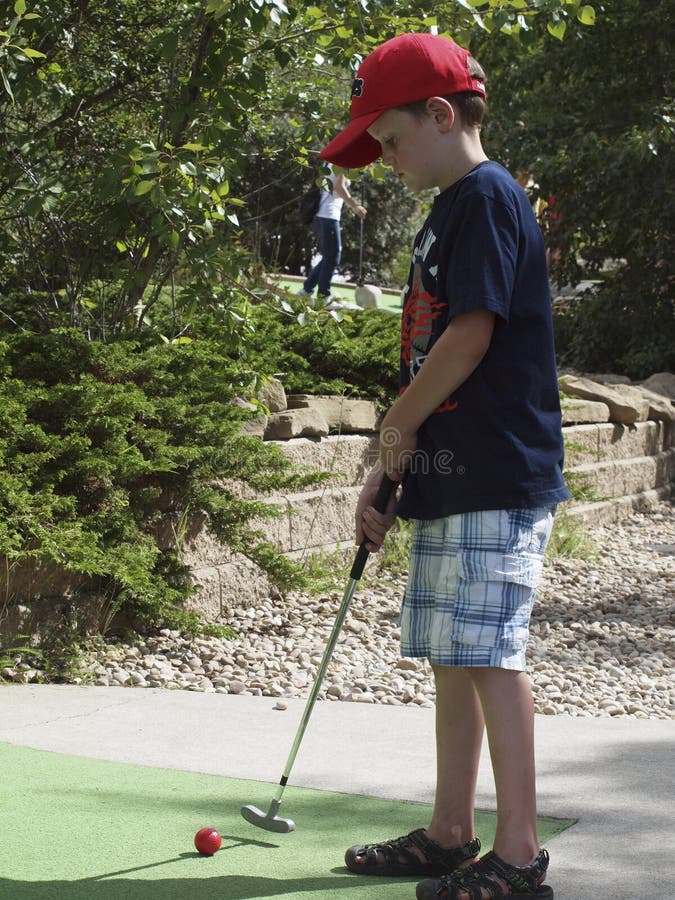 Child Playing Miniature Golf Stock Photo - Image of games, recreation ...