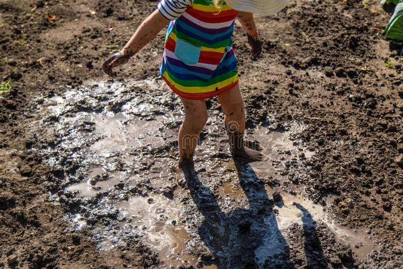 Child Playing in Mud. Selective Focus Stock Image - Image of nature ...