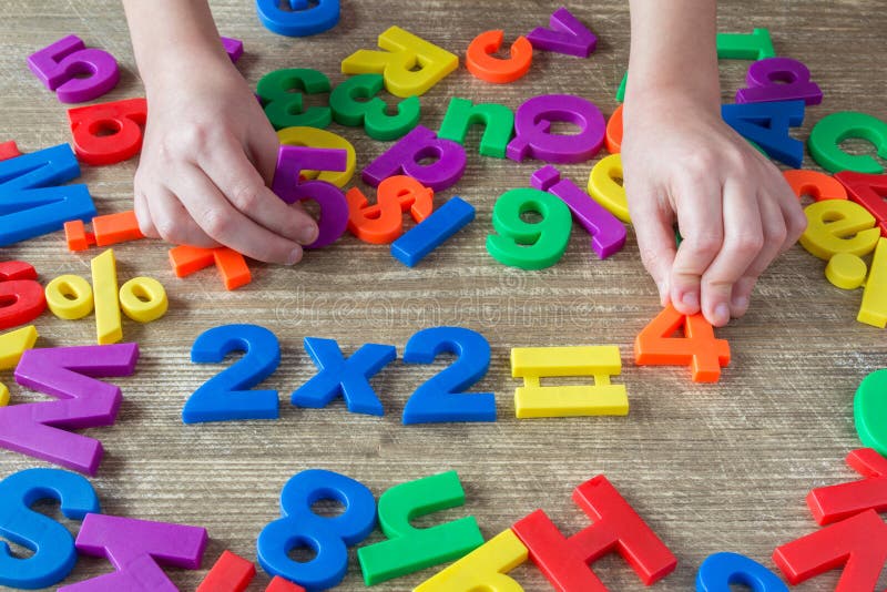 Child playing with numbers stock photo. Image of learning - 103230138