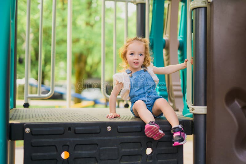 Child Playing on Outdoor Playground. Active Kid on Playground Summer ...
