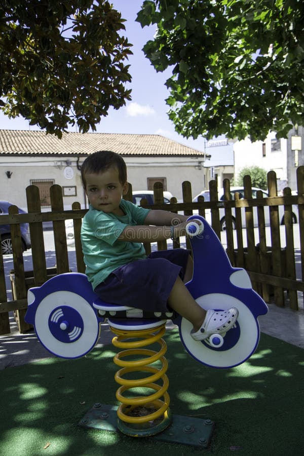 Child Playing Outdoors on the Carousel Stock Image - Image of childhood ...