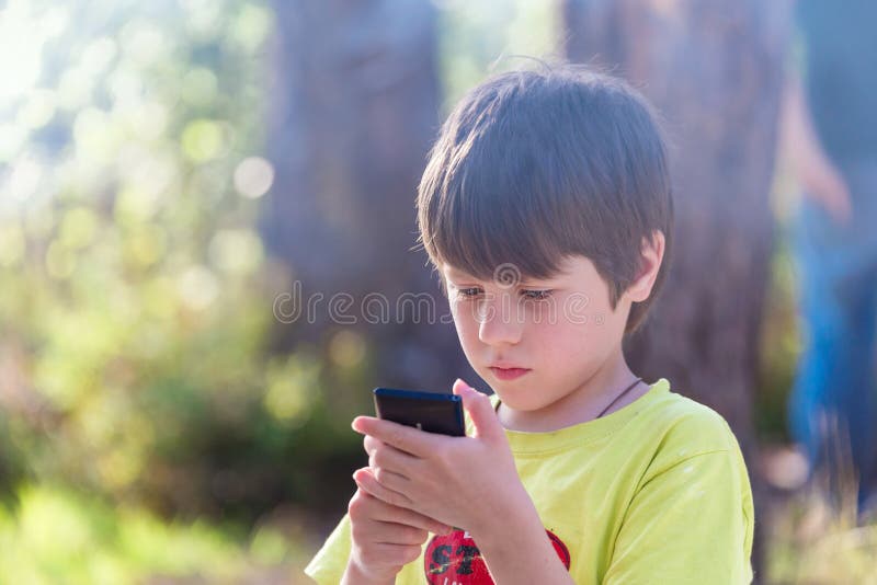 Child Playing Phone Outdoors Stock Image - Image of happy, happiness ...
