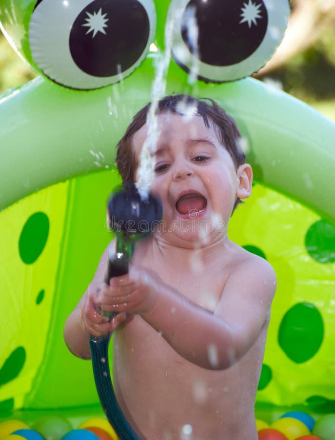 Child Playing in Plastic Pool Stock Photo - Image of bath, balls: 13263328