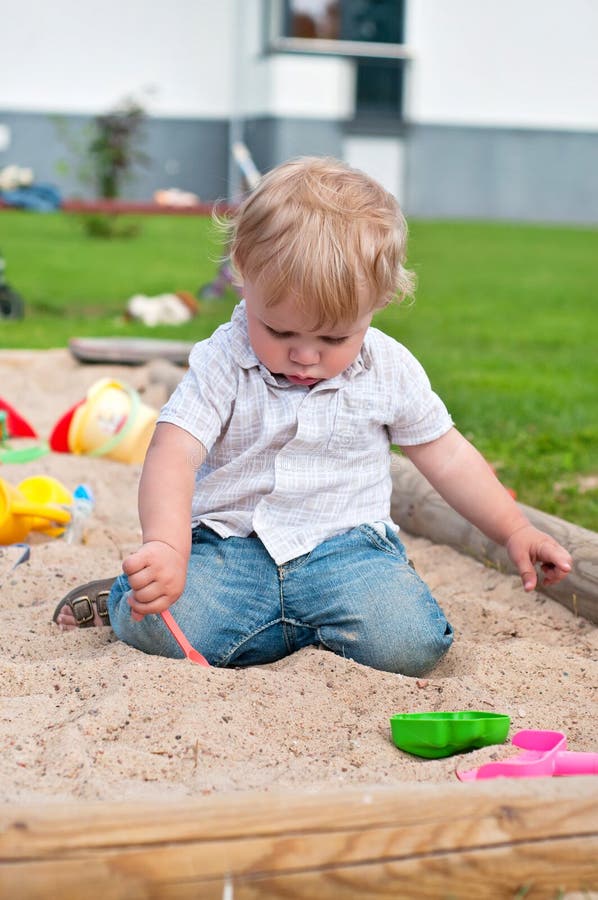 Child Playing on Playground in Sandbox Stock Image - Image of sand ...