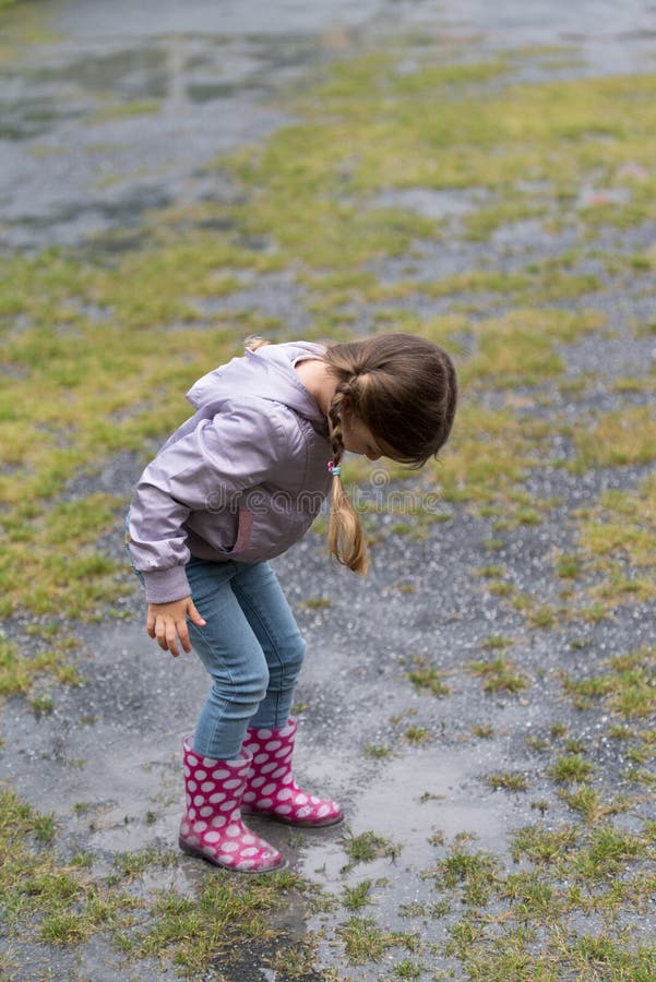 The Child Playing in a Puddle Stock Image - Image of childhood, happy ...