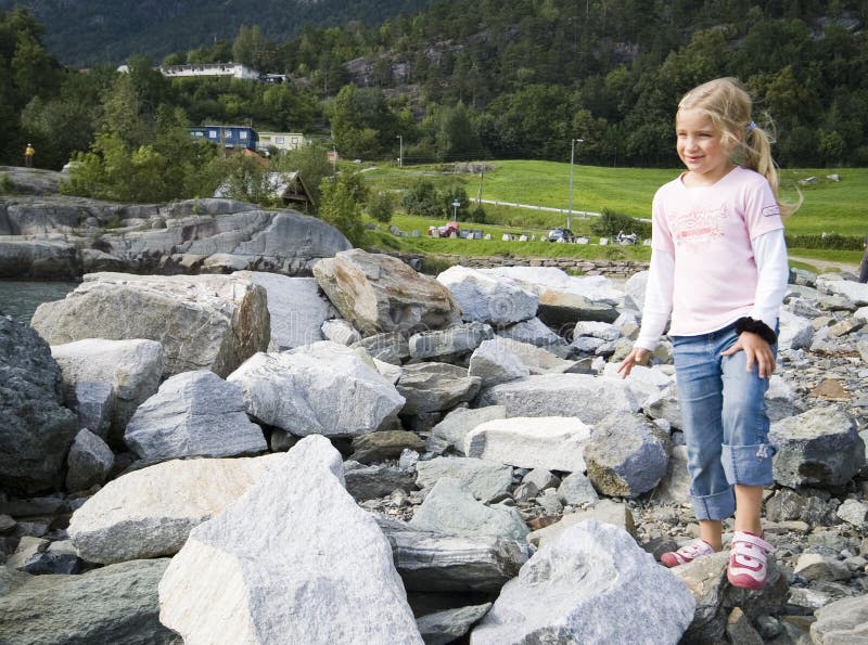 Child playing on rocks stock image. Image of kiddie, outdoors - 2995299