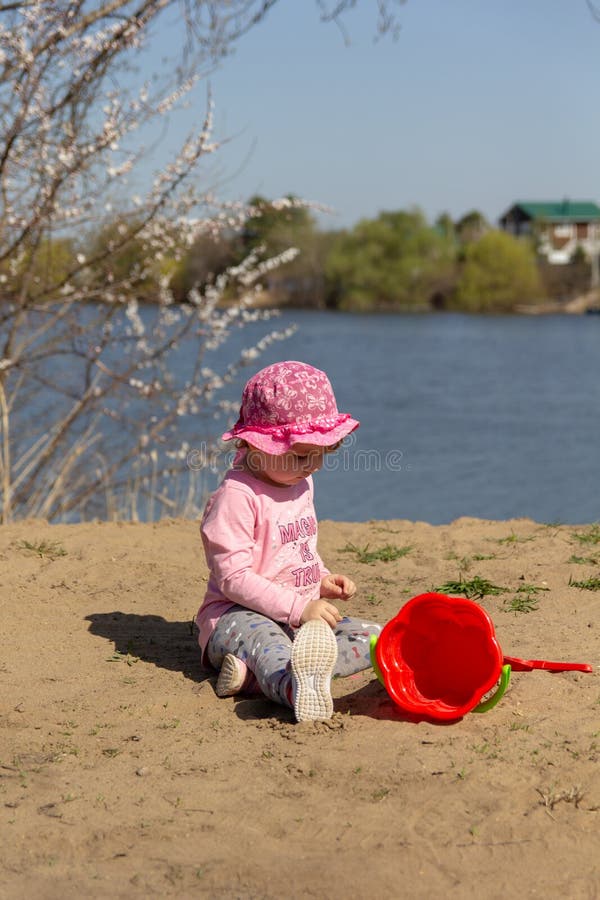 The Child is Playing in the Sand Stock Photo - Image of sandbox, baby ...