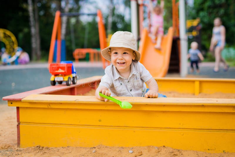 Child Playing in the Sandbox Stock Photo - Image of outdoors, active ...