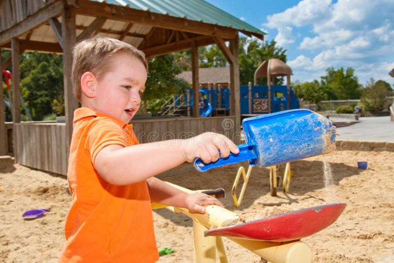 Child playing in sandbox stock photo. Image of hands - 32466680