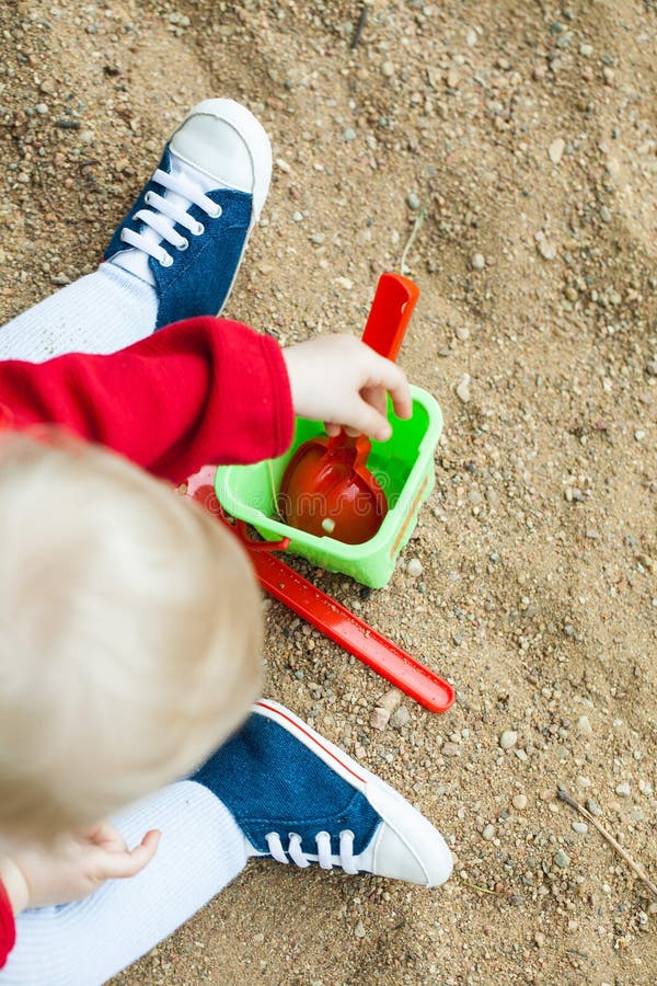 Child Playing in the Sandbox Shovel Stock Photo - Image of sandbox ...