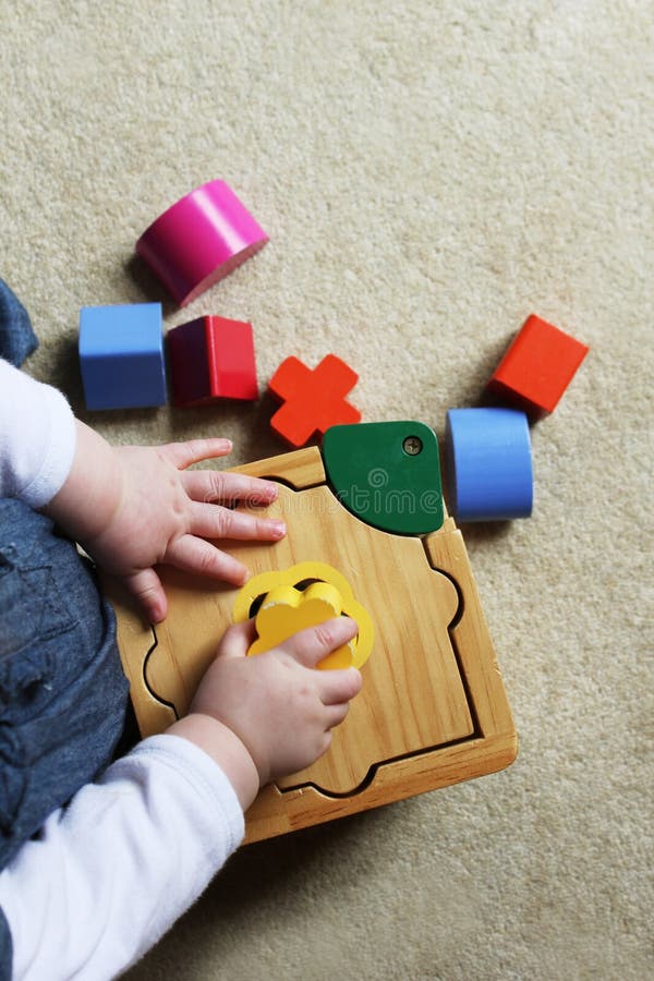 Child Playing with Shape Sorter Stock Photo - Image of child, fingers ...