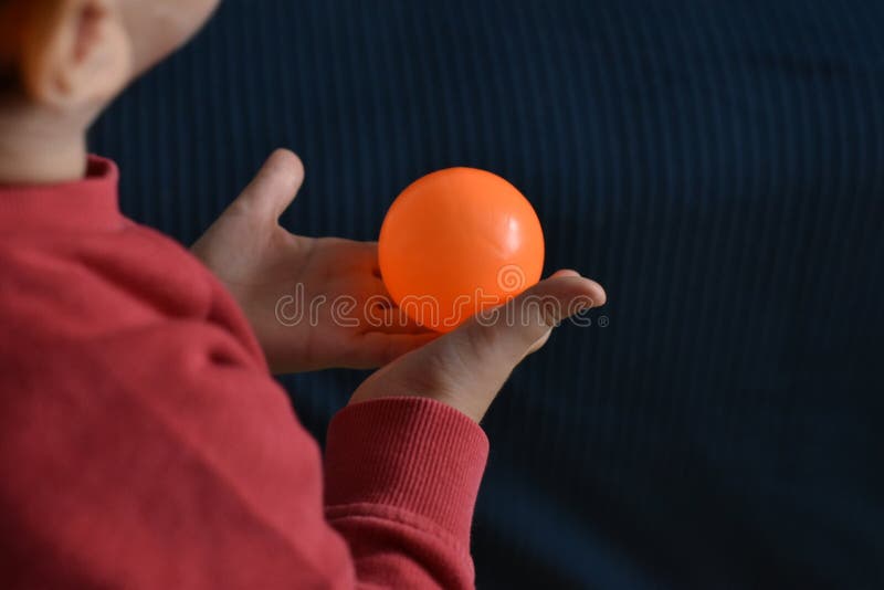 Child Playing with Small Ball Stock Image - Image of person, limb ...