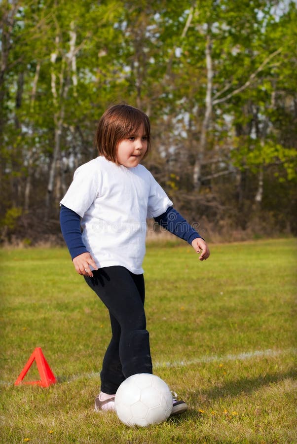 Child Playing Soccer stock photo. Image of spring, child - 14355368