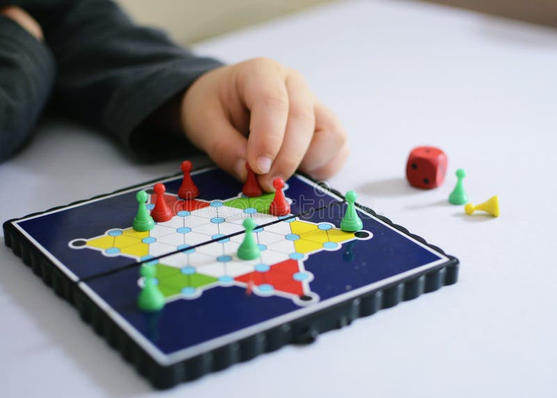 Child playing table game stock photo. Image of time - 130669316