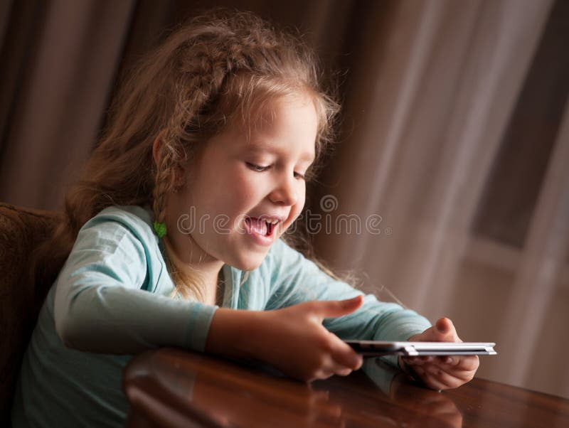 Child playing on tablet stock image. Image of girl, human - 28844503