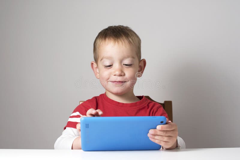 Child playing with tablet stock image. Image of horizontal - 72983077