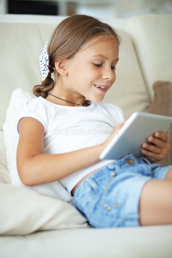 Child playing on tablet pc stock image. Image of cute - 32966693