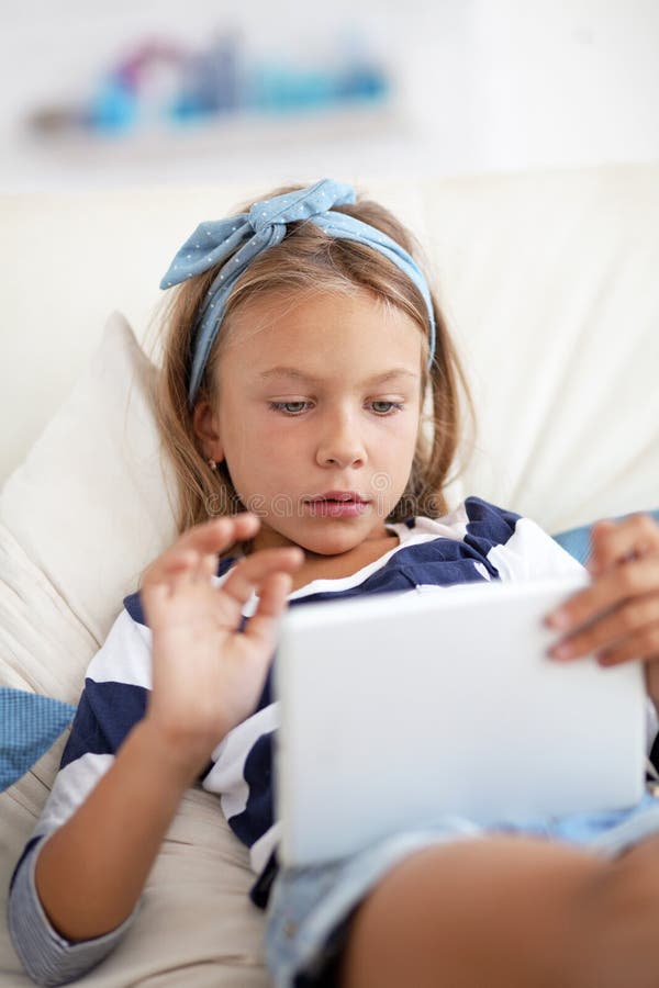 Child playing on tablet pc stock image. Image of cute - 32966693