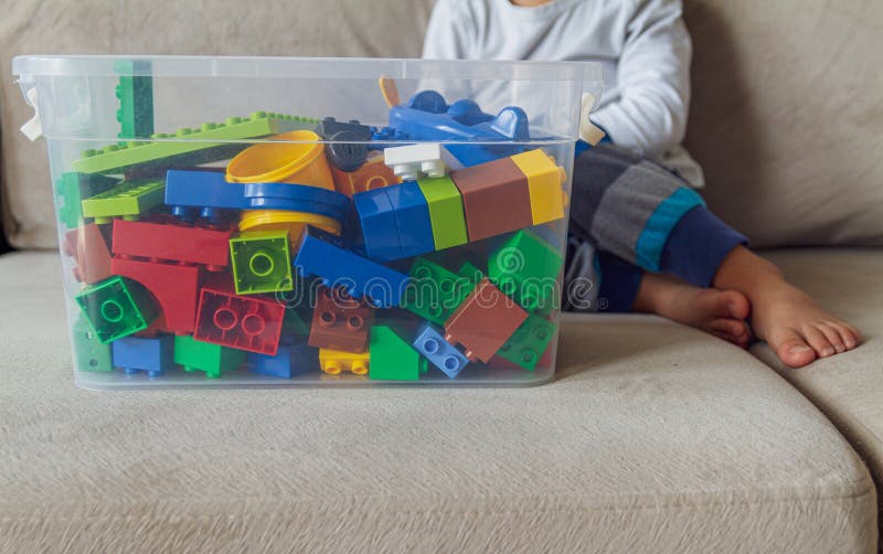 Child Playing with Toy Blocks Sitting on Sofa Stock Image - Image of ...