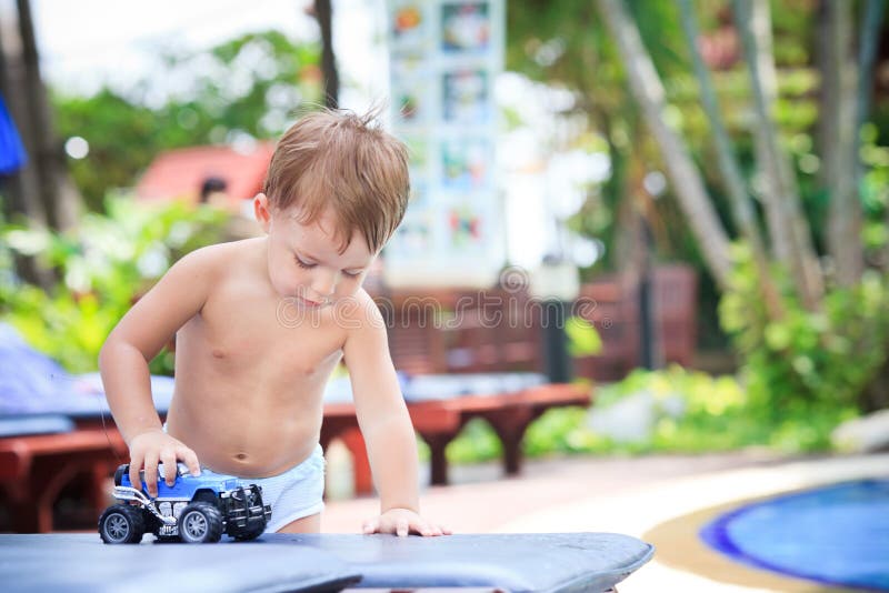 Child playing with toy car stock image. Image of children - 22808637